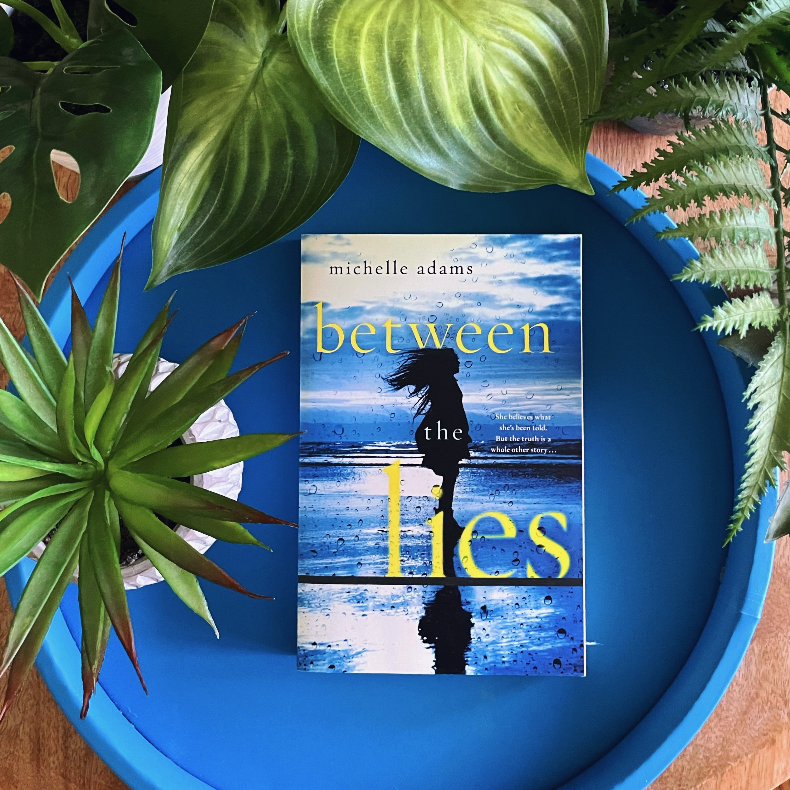 Book Review: Between the Lies | Michelle Adams - The PhDiva reads books
